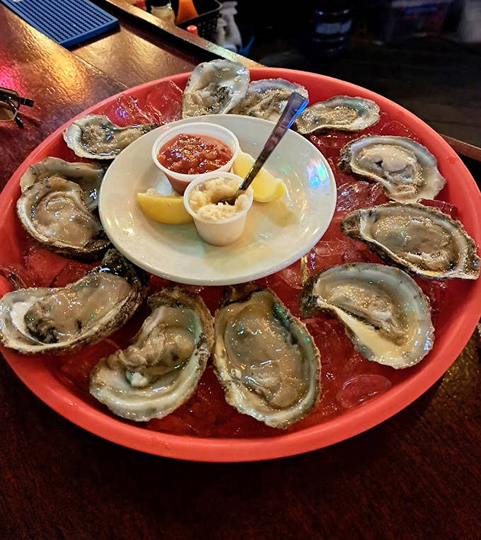 These oysters aren't just seafood – they're little cups of ocean perfection, served with all the fixings a purist could want.