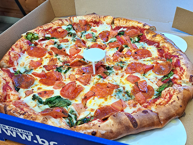 This isn't just any pepperoni pizza – it's a masterclass in balance with perfectly curled cups of savory goodness on a golden crust.