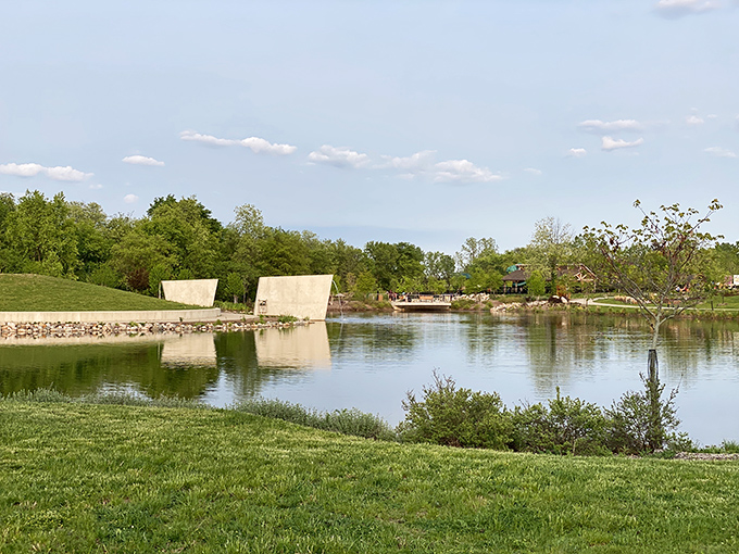 Tranquility meets recreation at the Innovation Hills pond, where water reflects clouds and creates a peaceful backdrop for family adventures.