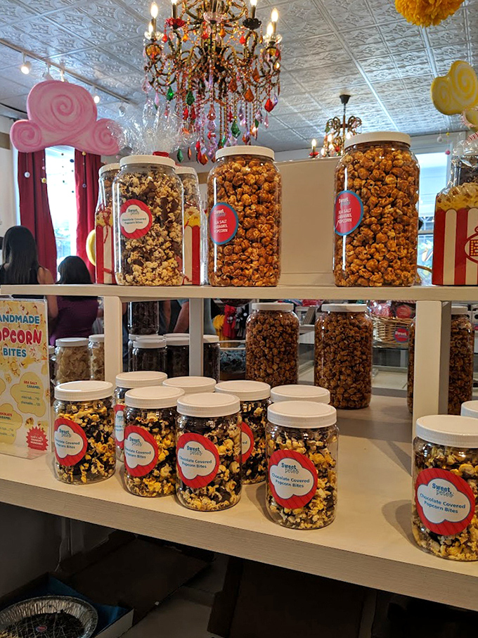 Giant jars of gourmet popcorn stand sentinel, tempting you with flavors that make movie theater varieties seem positively pedestrian.