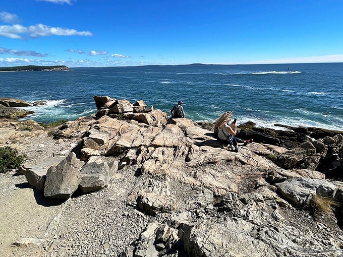 Nature's architecture on display where land meets sea, with waves performing their endless percussion against Acadia's rugged shoreline.