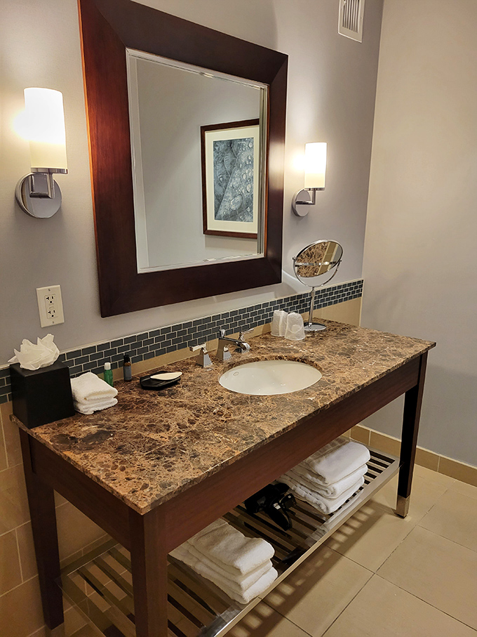 Marble vanities and elegant fixtures transform morning routines into luxurious rituals &ndash; who knew brushing teeth could feel so sophisticated?