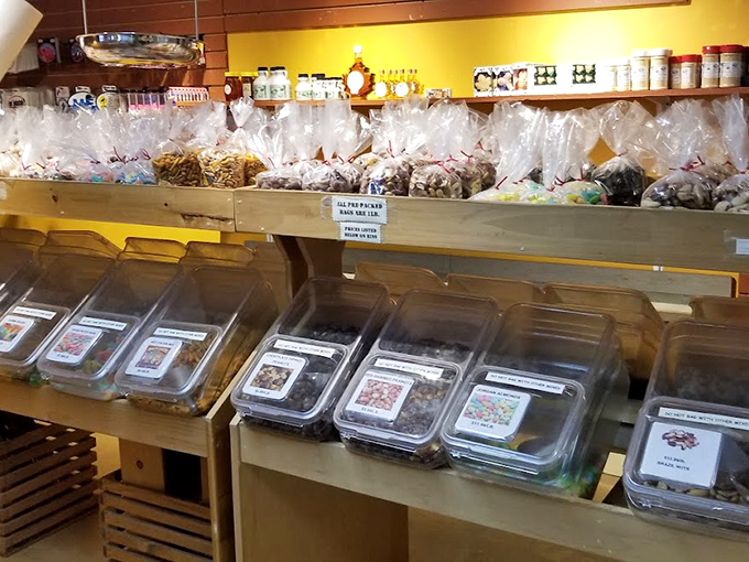 Packaged treats line the shelves, each bag promising a different adventure for your taste buds. Diet plans come here to die happy deaths.