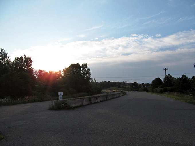 Golden hour hits different when you're standing on a road that's been ghosted by civilization and left on read by progress.