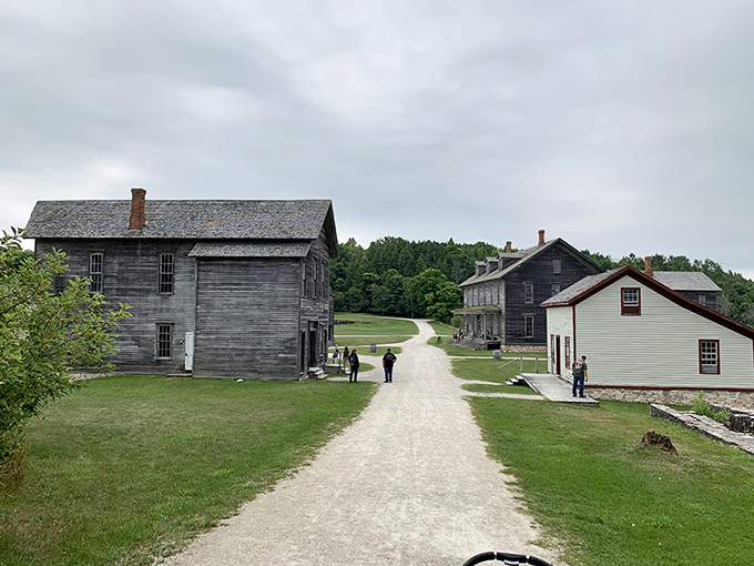 Visitors stroll along paths where workers once hurried between shifts, the quiet now a stark contrast to the bustling industrial past.