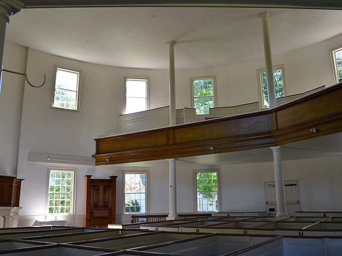 The second-floor gallery offers a bird's-eye view of the sanctuary, showcasing the craftsmanship that has endured for over two centuries.