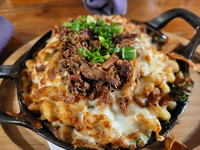Mac and cheese ascends to art form with this skillet of molten goodness topped with brisket &ndash; comfort food that's dressed for a night out.
