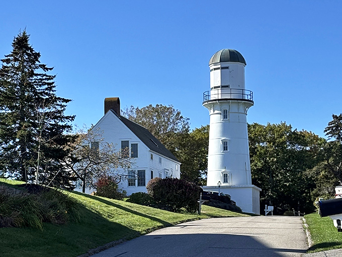 Cape Elizabeth Light watches over the Atlantic from its dramatic clifftop perch, white tower gleaming against the coastal landscape.