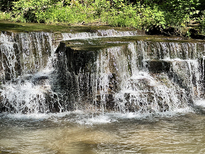 Caron Falls spreads across the rock like a liquid curtain, proving that waterfalls can be wide and wonderful, not just tall.
