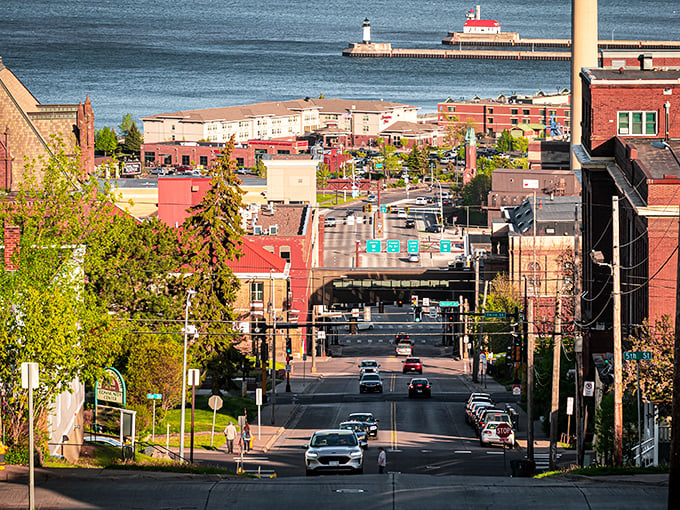 Duluth's hillside cityscape cascades down to Lake Superior's shore, where historic brick buildings meet the world's largest freshwater lake.