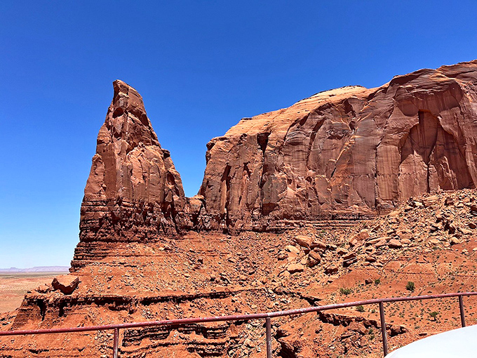 Monument Valley's iconic sandstone buttes stand like ancient skyscrapers, their red silhouettes defining the quintessential American Southwest landscape.