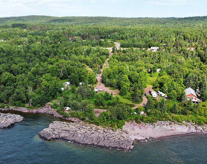 Schroeder's lush green shoreline showcases the perfect blend of forest and lake, with vacation cabins nestled among the trees along Lake Superior.