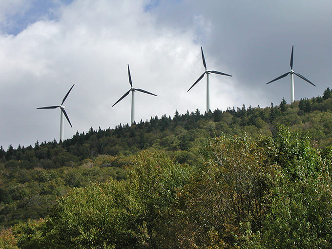Searsburg's wind turbines spinning against the sky prove that Vermont can honor its natural beauty while embracing clean energy for the future.