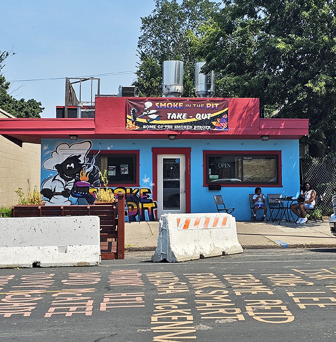 Smoke in the Pit's vibrant blue building with colorful murals brings personality to Minneapolis &ndash; this tiny takeout spot packs enormous flavor into every smoky bite.
