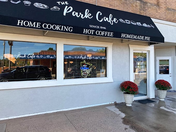 The Park Cafe proudly announces "Home Cooking," "Hot Coffee," and "Homemade Pie" on its classic storefront in the self-proclaimed Pie Capital of Minnesota.