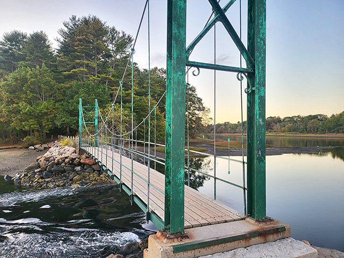 America's smallest suspension bridge lives up to its name with every step, swaying gently above York's tidal waters.