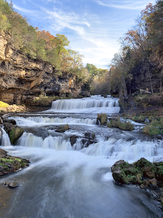 Willow River Falls cascades in multiple tiers, creating a mesmerizing display of water's endless journey through the landscape.