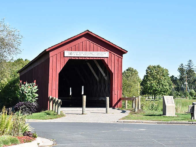 The historic red Zumbrota Covered Bridge stands as Minnesota's last remaining covered bridge, beautifully preserved since 1869.