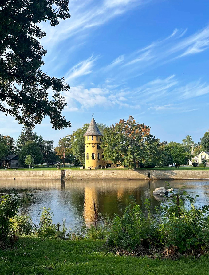 This charming yellow tower stands sentinel by the river in Owosso, reflecting in the water like something from a children's fantasy book.