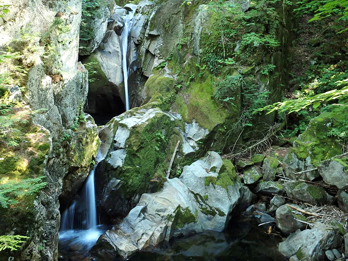 Nature's power on full display as The Cataracts thunder through massive boulders in this hidden Maine gem.