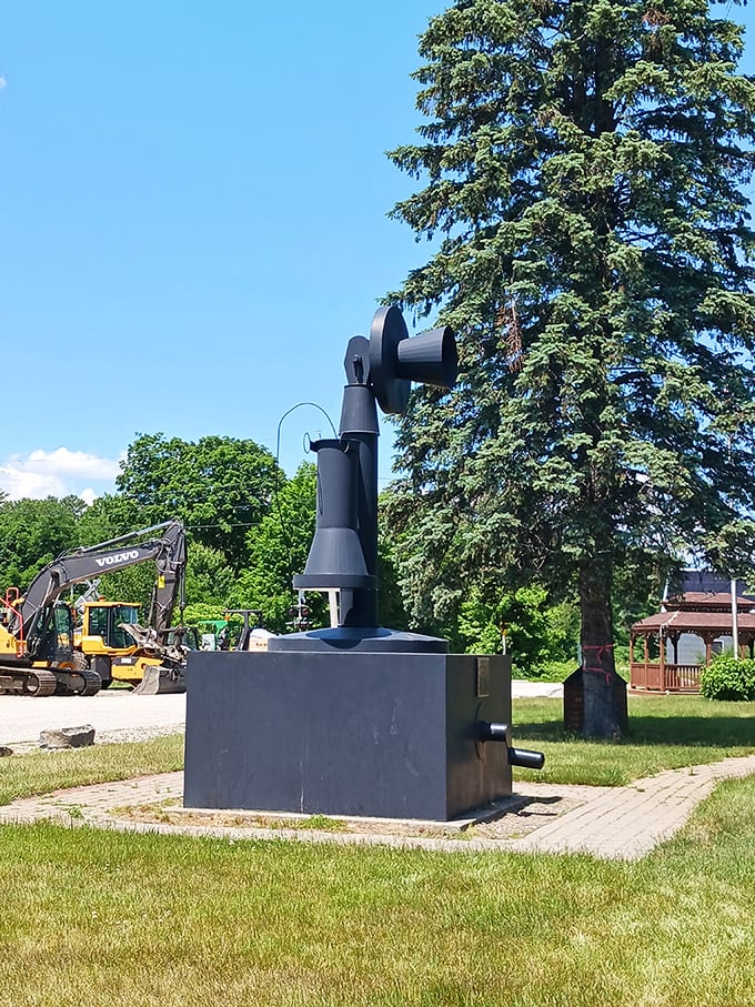 This oversized black telephone sculpture celebrates technological stubbornness in charming Bryant Pond, where progress arrived fashionably late.