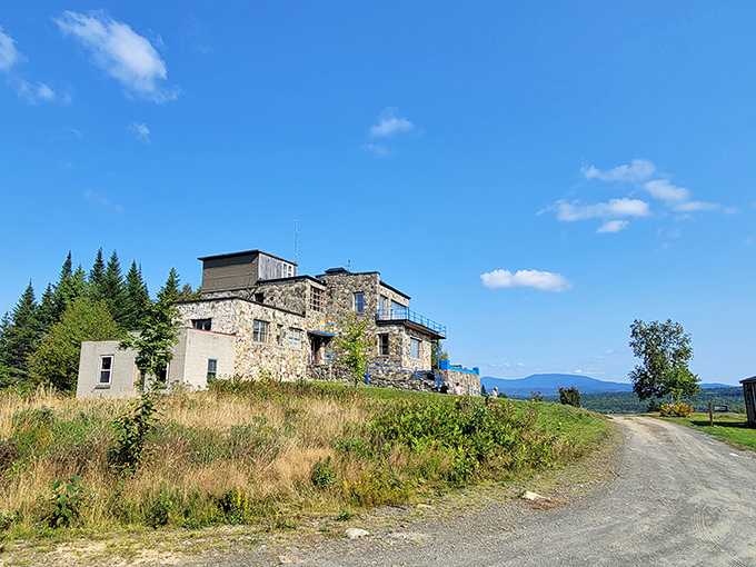 Orgonon's distinctive stone buildings emerge from the hillside, offering visitors both scientific curiosity and spectacular mountain panoramas.