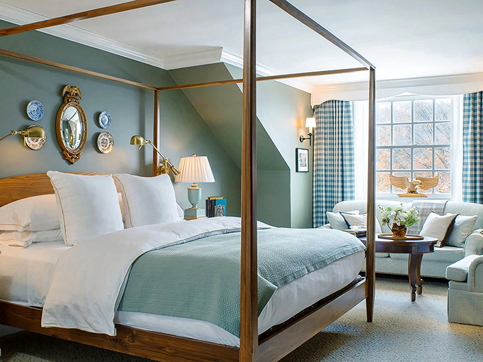 Morning light dances through windows in this blue sanctuary, where the four-poster bed promises dreams sweeter than Vermont maple syrup.