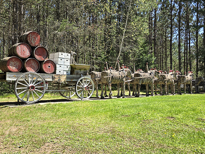 The famous Budweiser Clydesdale team pulls its wagon eternally forward, crafted with surprising detail from humble concrete and glass.