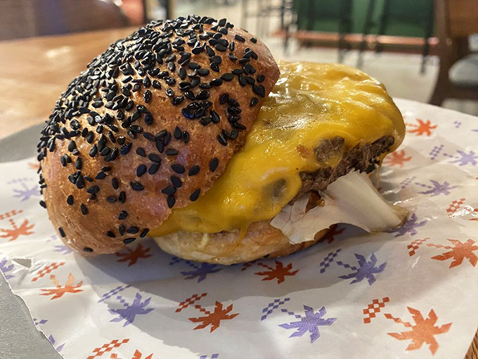 This isn't just a burger &ndash; it's a towering monument to the perfect marriage of beef, cheese, and sesame-studded bun.