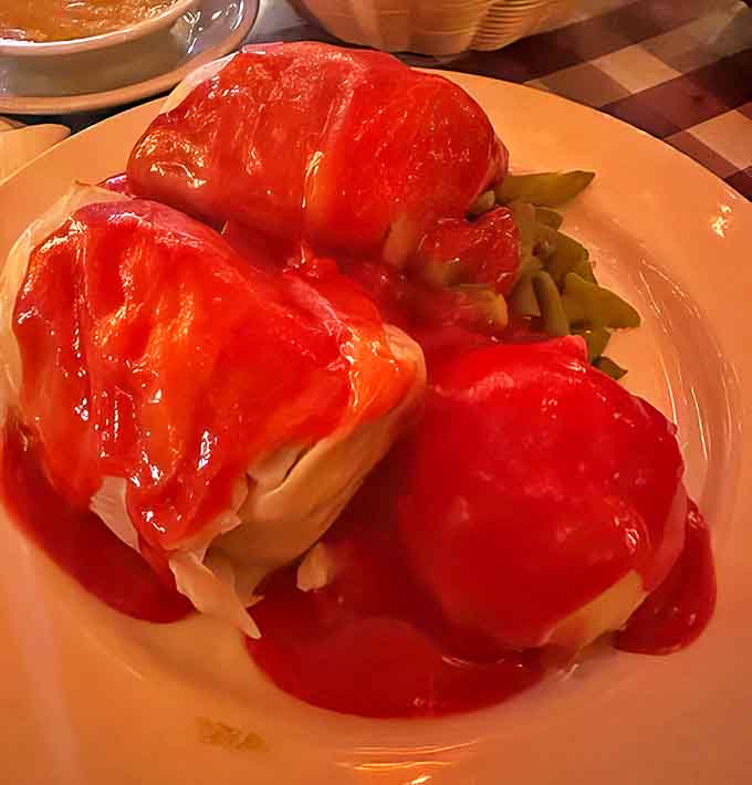 Stuffed cabbage rolls bathed in bright tomato sauce &ndash; comfort food that wraps you up like your favorite blanket on a cold day.
