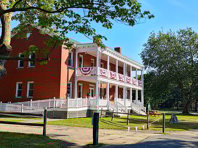 This red brick officers' quarters with patriotic bunting stands as a colorful reminder of Fort Williams' defensive past.