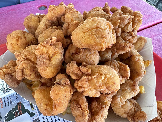 These whole belly clams aren't just fried – they're transformed into crispy, briny bites of Maine coastline in every mouthful.