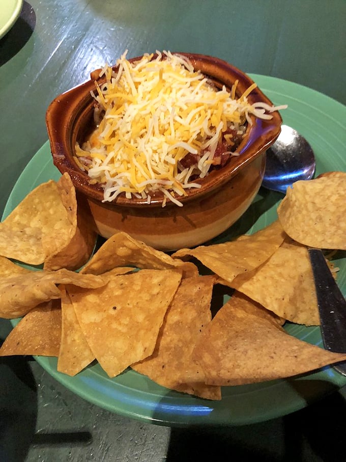 Hearty chili topped with melted cheese and surrounded by crisp tortilla chips &ndash; comfort food that warms you from the inside out.