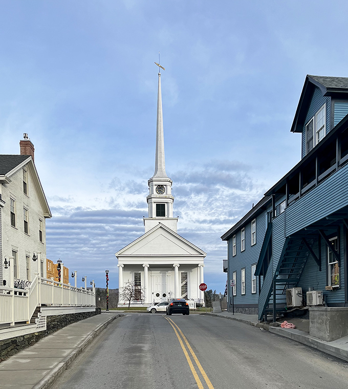 The iconic white steeple of Stowe Community Church pierces the sky, serving as both spiritual beacon and photographer's dream.