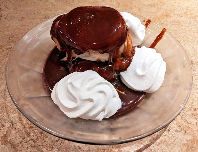 This cream puff sundae isn't just dessert, it's therapy &ndash; clouds of whipped cream surrounding a chocolate-drenched pastry that would make your cardiologist weep.