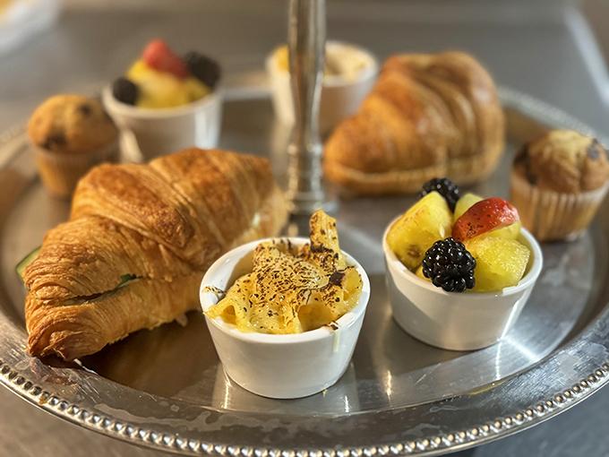 Morning at the castle brings these buttery croissants that shatter into delicate flakes, paired with seasonal fruit cups glistening with natural sweetness.