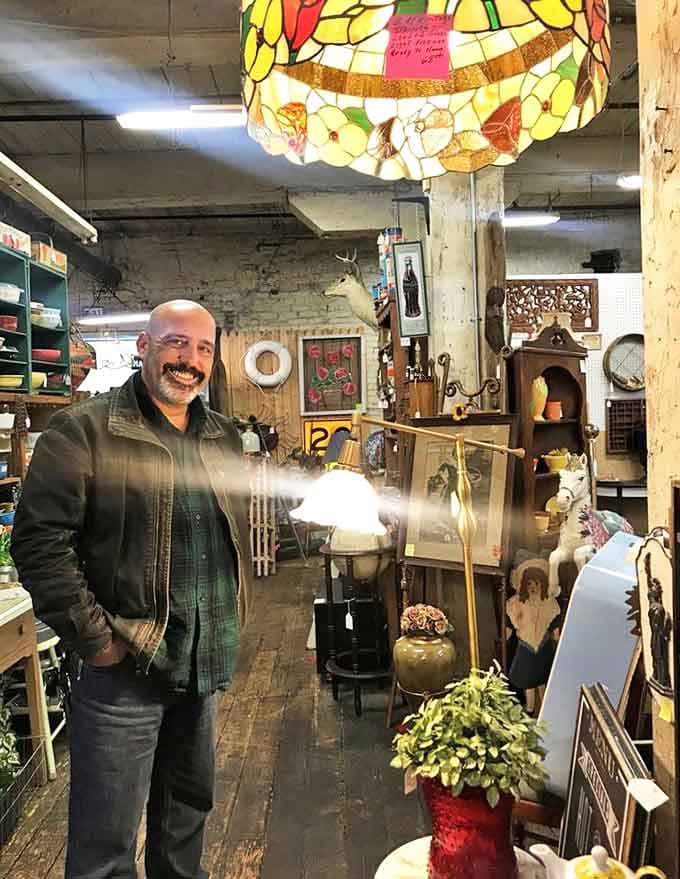 Every aisle offers new discoveries, as this smiling visitor demonstrates while surrounded by decades of American material culture.