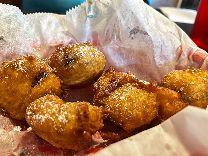 Deep-fried Oreos transform the humble cookie into a warm, gooey indulgence. The powdered sugar isn't hiding anything &ndash; these are gloriously, unapologetically decadent.