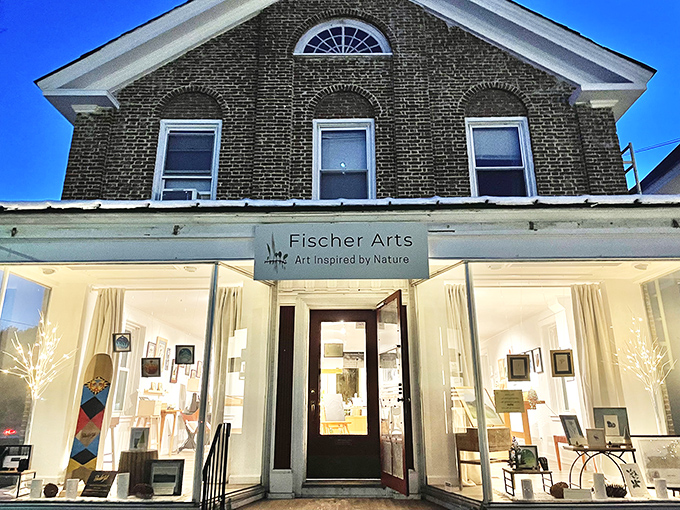 Fischer Arts gallery showcases nature-inspired creativity in a historic building where sunlight streams through generous windows, illuminating local talent.