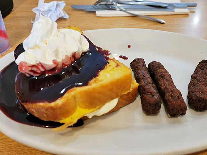 French toast that would make Paul Bunyan weep with joy, accompanied by sausage links that mean serious breakfast business.