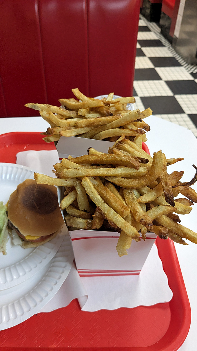 The star of the show: hand-cut, twice-fried potatoes that achieve the perfect balance of crispy exterior and fluffy interior.