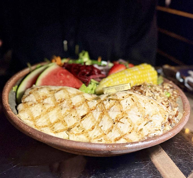 A plate that captures Minnesota's essence &ndash; perfectly grilled whitefish nestled alongside vibrant vegetables and sweet corn, all kissed by summer sunshine.