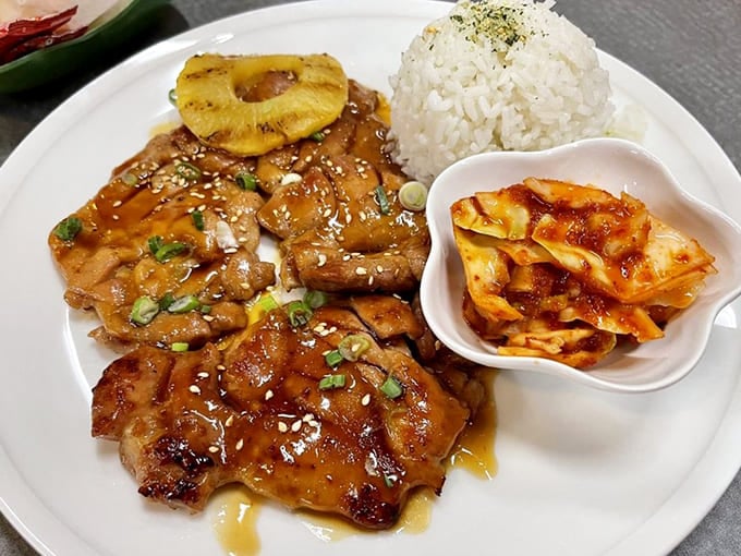 Huli Huli Chicken with its grilled pineapple crown, proving that fruit belongs on savory dishes and anyone who disagrees is wrong.
