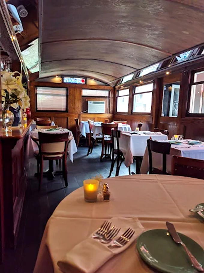 White tablecloths and vintage charm create an atmosphere where time slows down and dinner becomes the evening's main event.