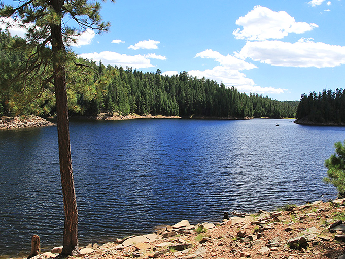 Crystal waters mirror the perfect blue sky at one of the rim's many alpine lakes, each a refreshing surprise in this mountainous escape.