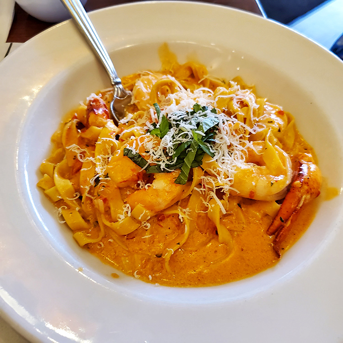 The shrimp and lobster fettuccine arrives like a seafood celebration, with tender pasta ribbons playing host to the ocean's finest treasures.