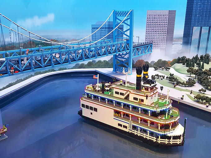 MINILAND's Ambassador Bridge spans a sea of blue bricks, with tiny cars perpetually making their international journey between plastic Detroit and Canada.
