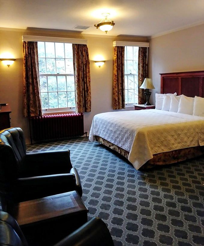 The master bedroom offers comfort and period charm, though don't be surprised if the perfectly made bed shows mysterious indentations come morning.