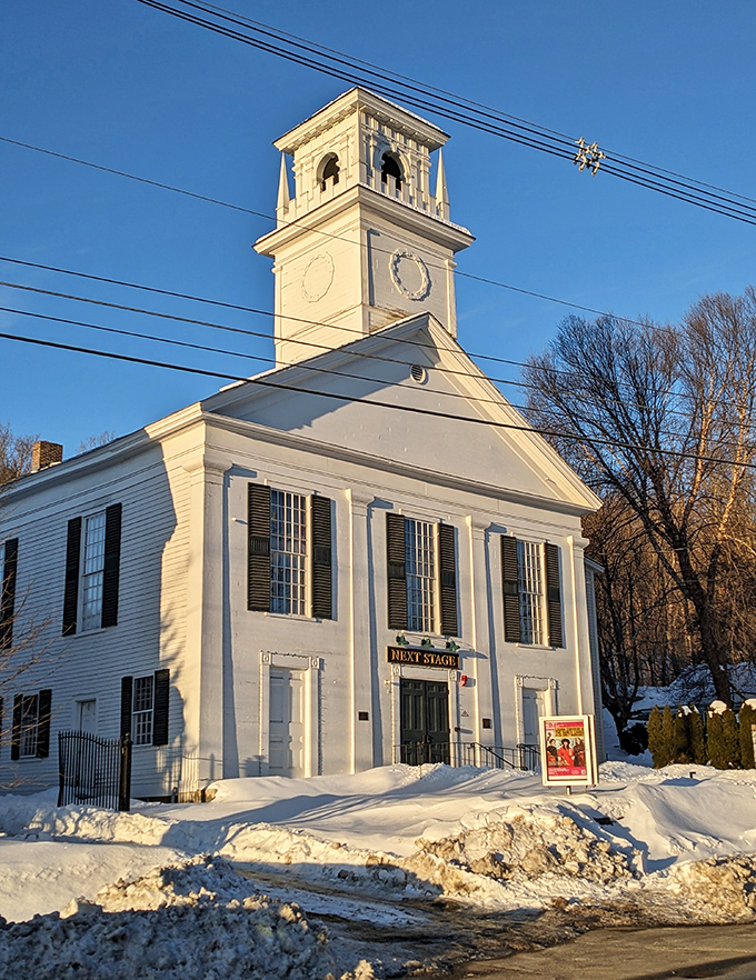 Next Stage Arts glows against winter snow, showcasing Putney’s vibrant commitment to culture, creativity, and community.