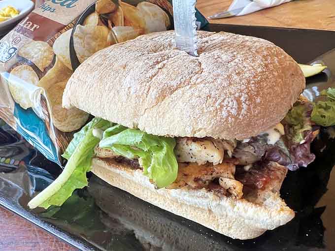 Burgers arrive as carefully constructed towers of flavor that require both hands and possibly an engineering degree to eat properly.